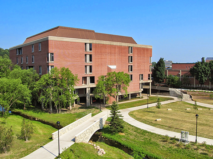 The University of Wisconsin-Eau Claire's McIntyre Library stands as a brick monument to knowledge, where future innovators fuel up on caffeine and inspiration.