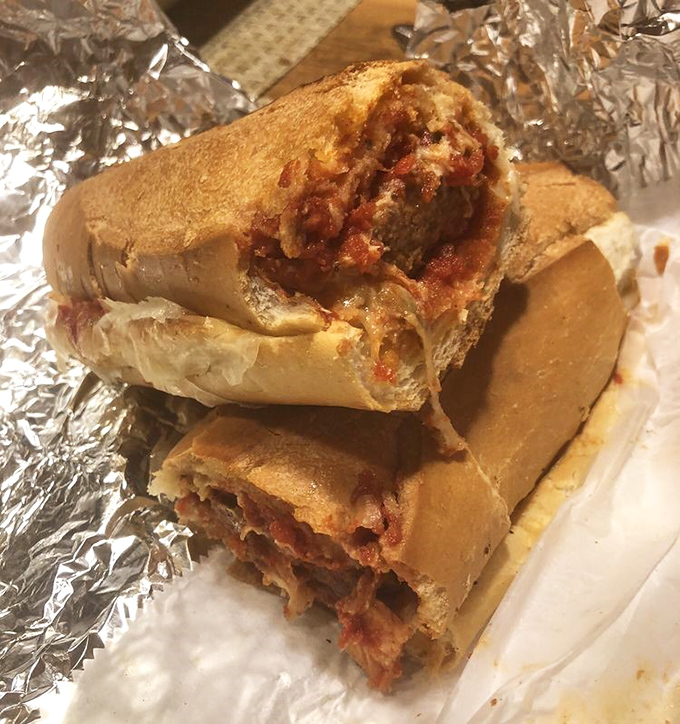 The meatball parm hero: where sandwich meets salvation. This isn't lunch; it's an emotional experience wrapped in foil.