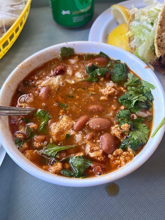 This isn't just menudo&mdash;it's a restorative bowl of tradition, floating with tender tripe and hominy, garnished with fresh cilantro that brightens each spoonful.