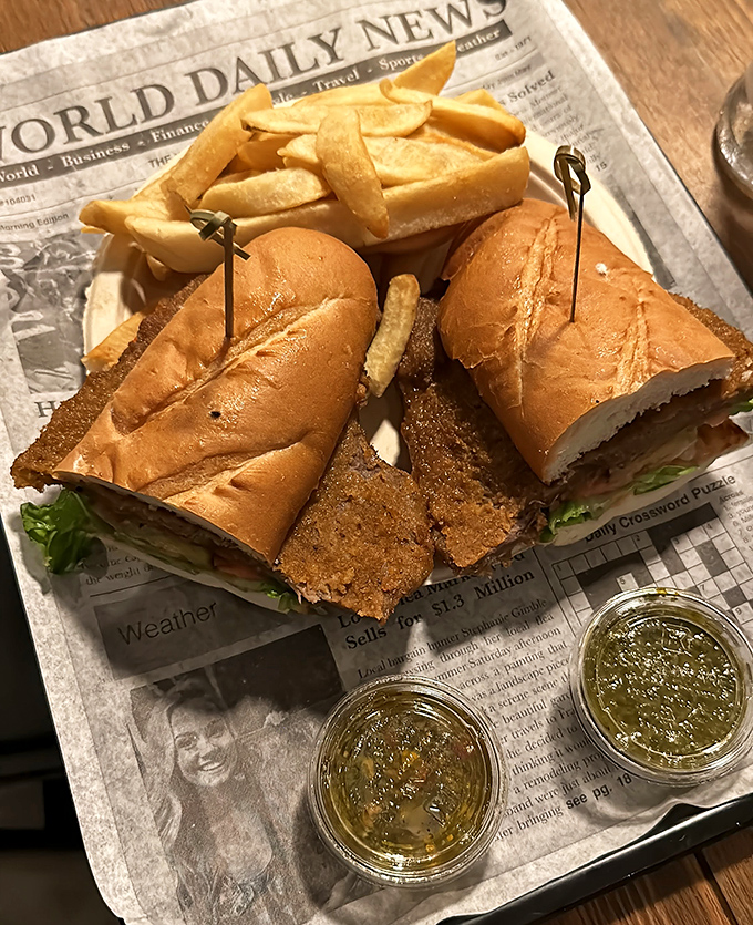 The newspaper isn't the only thing worth reading here. This schnitzel sandwich tells a story of crispy perfection between bread.