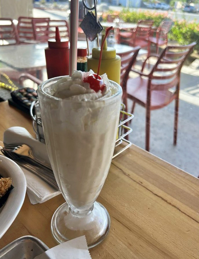 The milkshake that brings everyone to the yard. Topped with whipped cream and a cherry, it's nostalgia in a glass.