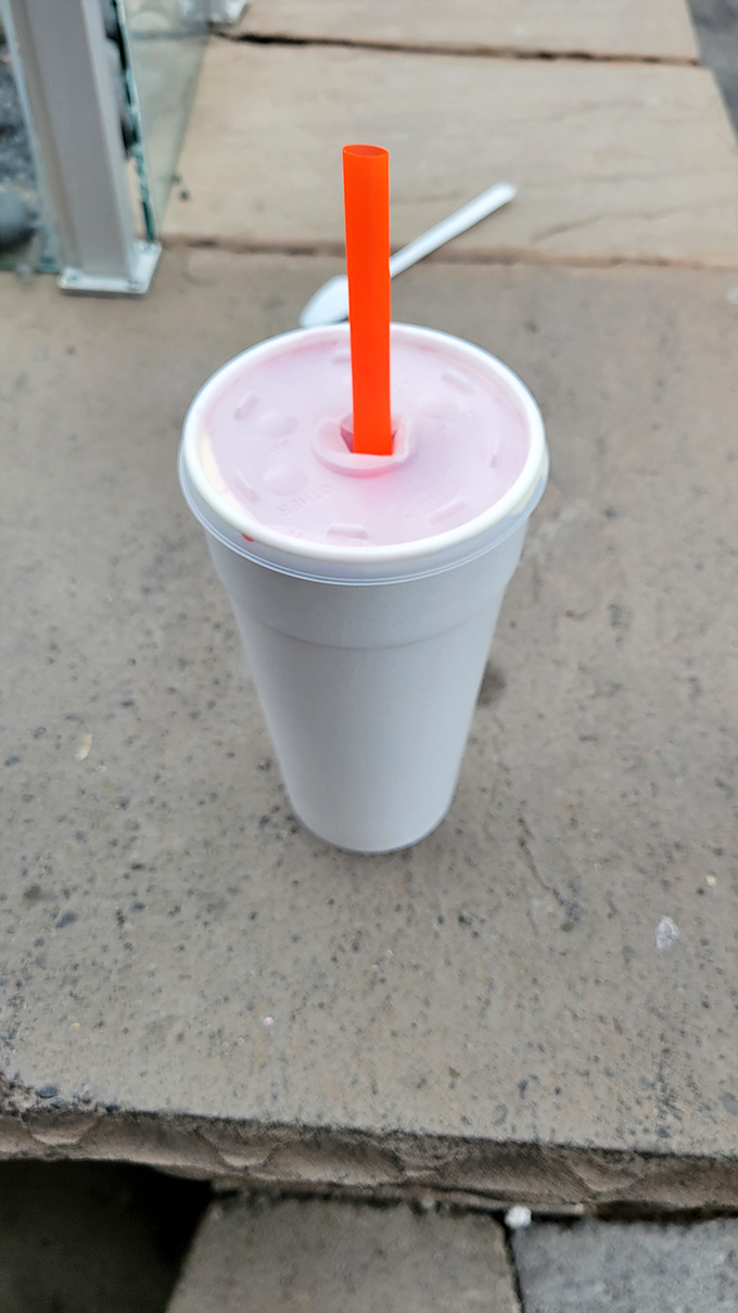 Pink perfection in a cup – this strawberry shake is thick enough to support a spoon standing at attention.