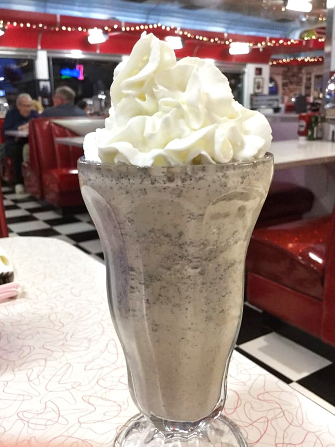 A proper diner milkshake: so thick the straw stands at attention, topped with a cloud of whipped cream that defies gravity.