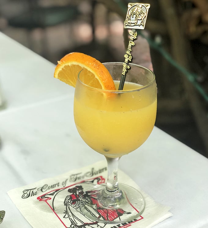A mimosa at Court of Two Sisters isn't just a brunch cocktail&mdash;it's liquid sunshine in a glass, complete with a souvenir stirrer.