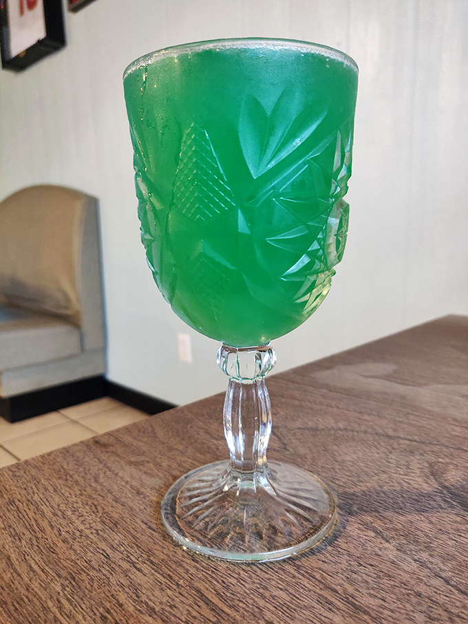 That emerald green goblet isn't holding kryptonite &ndash; it's a mimosa that's dressed up fancier than most of the customers.