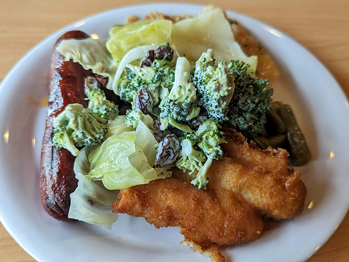 A colorful plate loaded with broccoli, sausage, and breaded favorites demonstrates the beautiful chaos that happens when you can choose everything at once.