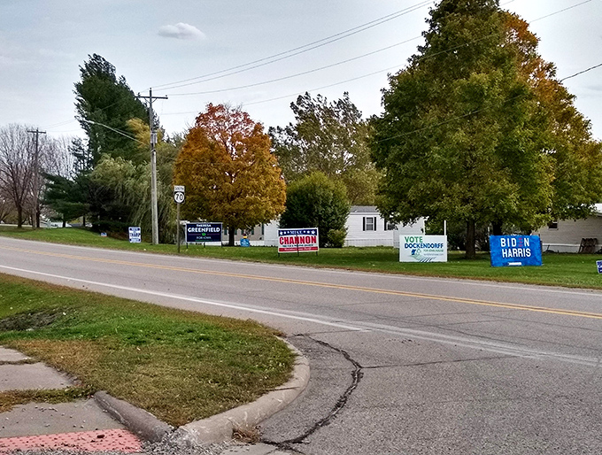 Political signs dot the roadside, proving that even in small-town Iowa, residents care deeply about having their voices heard.