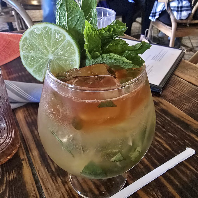 This isn't just a mojito; it's Florida sunshine in liquid form, with mint so fresh it deserves its own fan club.
