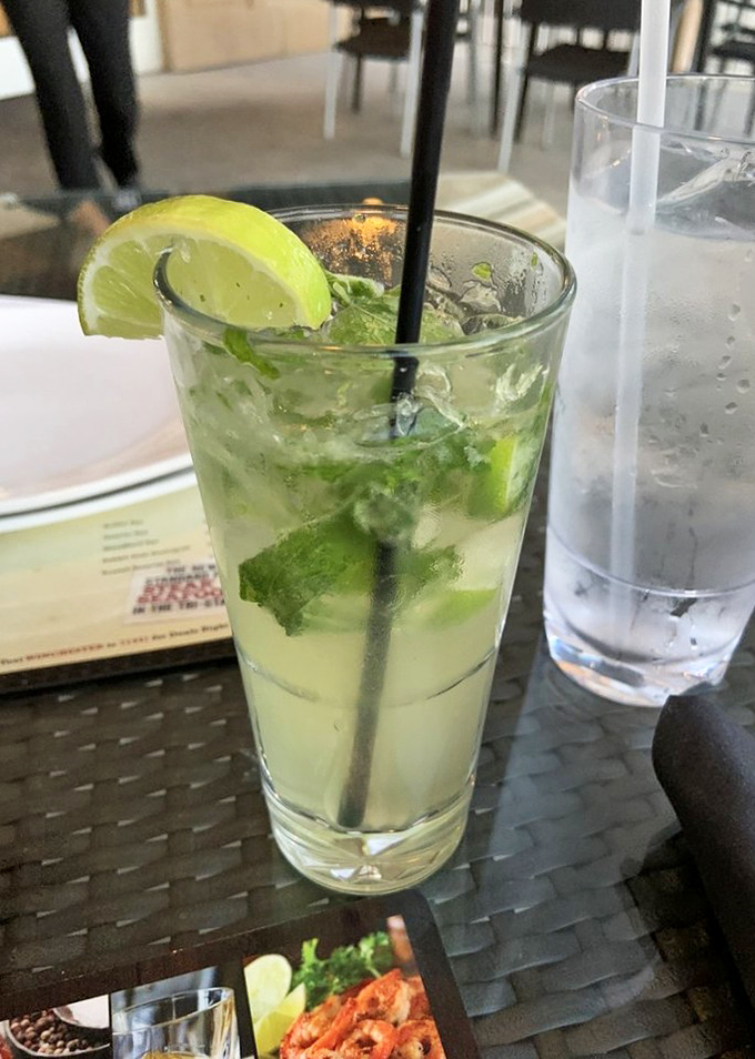A mojito that looks like summer in a glass—fresh, bright, and ready to cut through all that barbecue richness. Mint and lime: BBQ's unexpected best friends.