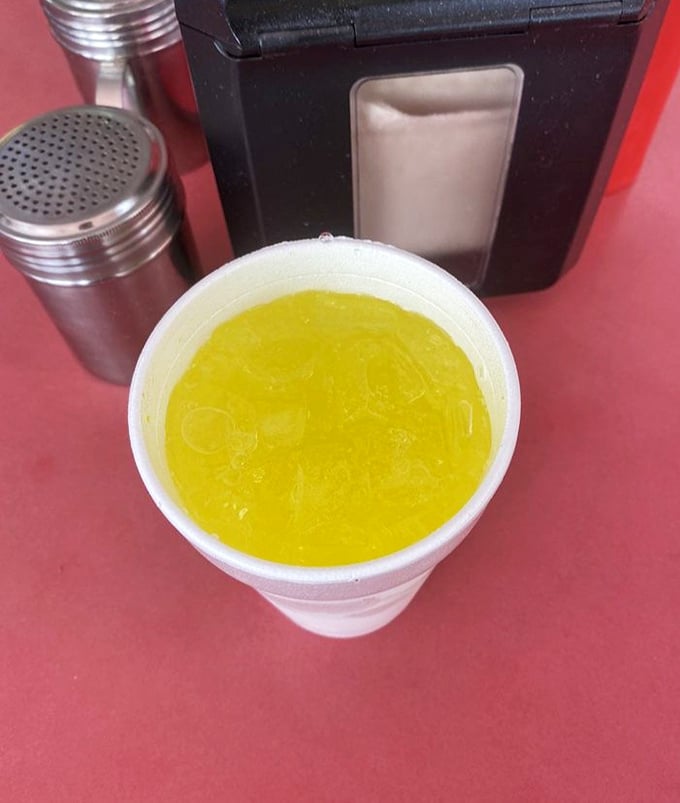 Even the Mountain Dew looks more vibrant against CJ's signature red tables&mdash;the perfect sweet counterpoint to the savory feast that awaits.