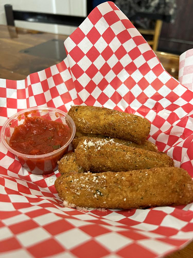 These aren't your average mozzarella sticks—they're the crispy, golden-brown ambassadors of comfort food diplomacy, complete with marinara for dipping negotiations.