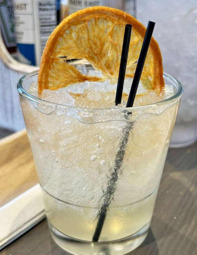 The Nashville Sunrise cocktail brings citrus sunshine to your morning, with a dehydrated orange slice that's practically art.