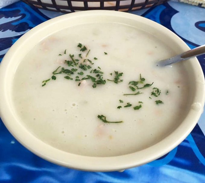 Clam chowder so creamy it should require a permission slip. That gentle sprinkle of herbs is like putting a bow on an already perfect package.