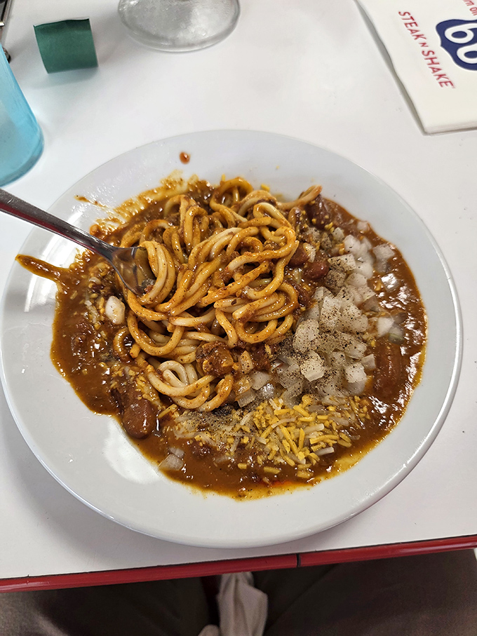 Chili Mac: where spaghetti meets Midwest magic. Carbs wearing their Sunday best, topped with savory perfection.