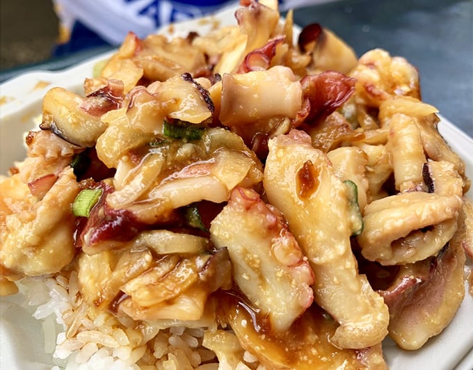 Tako (octopus) poke offers a delightful chewiness that seafood aficionados treasure. The marinade penetrates each piece, creating flavor bombs in every bite.