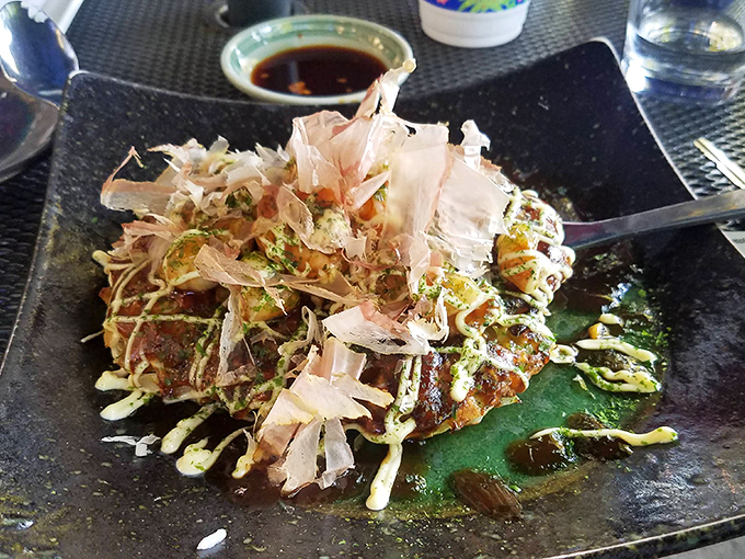 Okonomiyaki topped with dancing bonito flakes &ndash; Japan's answer to "how can we make pancakes extraordinary?"