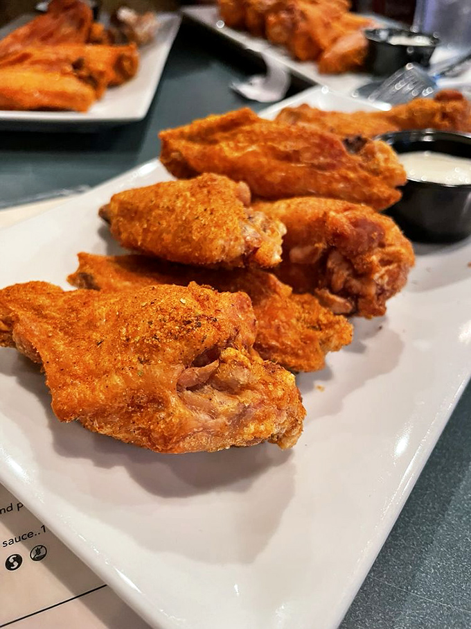 These wings aren't just spicy&mdash;they're a coastal Virginia handshake, Old Bay seasoning creating a flavor profile that bridges Irish tradition with Chesapeake Bay attitude.