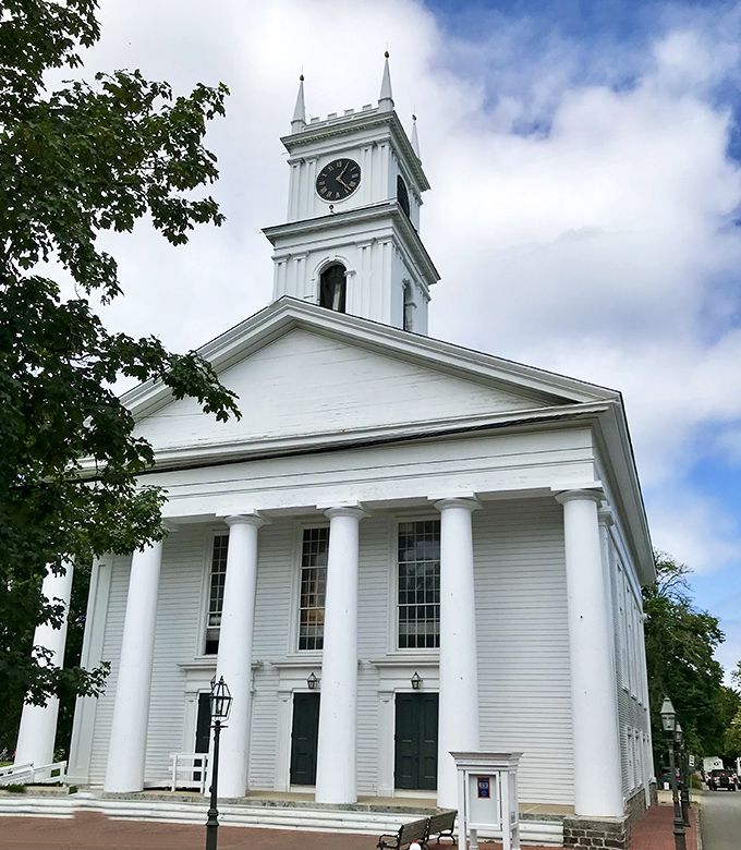 The Old Whaling Church stands like a wedding cake in architectural form, its gleaming white columns and steeple reaching skyward with Yankee determination.
