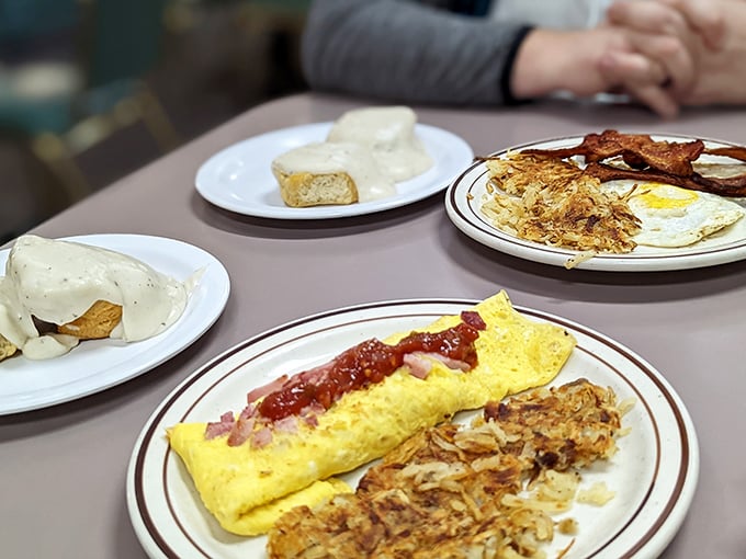 Breakfast alchemy happens here daily. This golden omelet with crispy hashbrowns proves morning meals deserve serious respect. 
