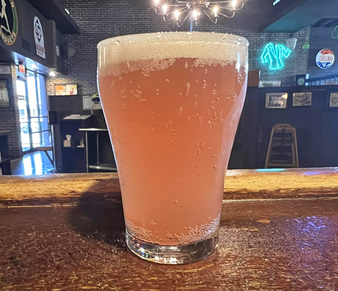 Nothing complements pizza like a cold, frothy beverage &ndash; this amber delight waits patiently at the bar for its perfect pizza pairing.