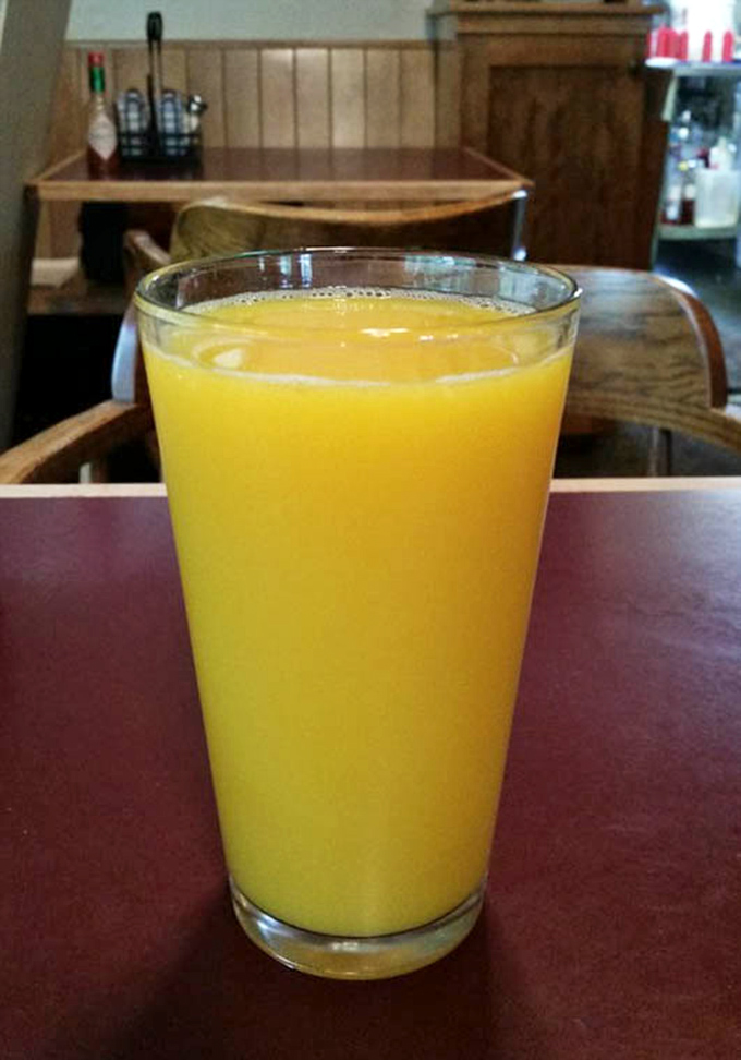 Fresh-squeezed orange juice so vibrant it makes store-bought look like a sad, distant cousin who wasn't invited to the family reunion.