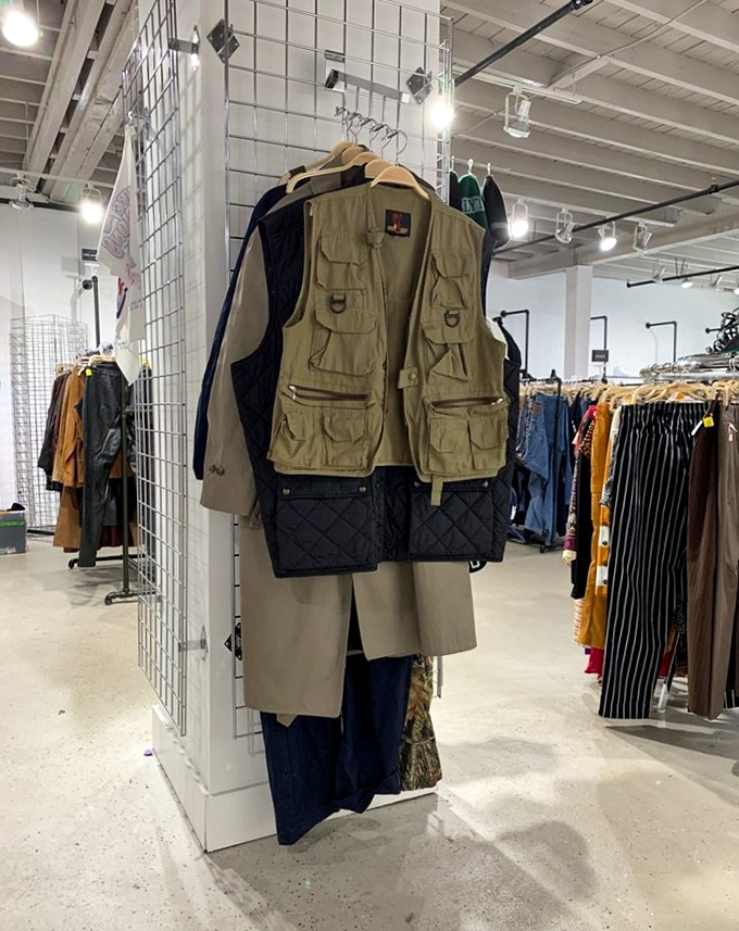 That utility vest hanging front and center is ready for someone's next adventure, pockets and all.
