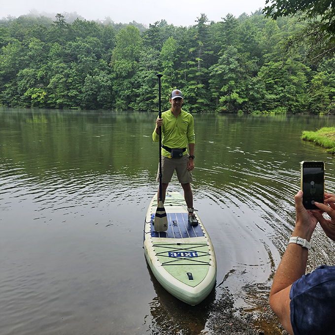 Stand-up paddleboarding on glassy mountain waters &ndash; where serenity meets exercise and nobody minds if you fall in occasionally.