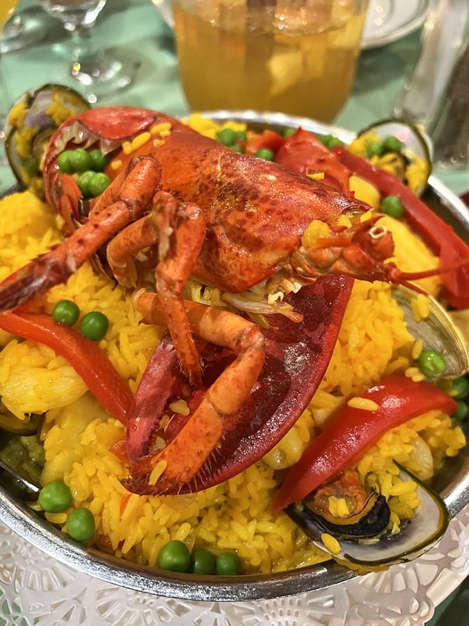 Paella that's dressed to impress with a lobster crown. This saffron-infused rice dish is what happens when seafood throws its most exclusive party.