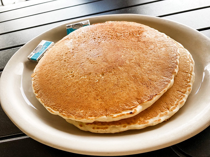 Pancakes so perfectly golden they belong in Fort Knox, with a fluffiness that defies the laws of breakfast physics.