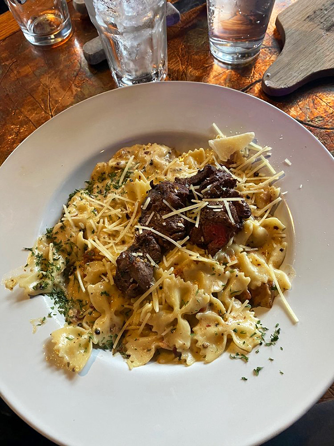 Pasta meets steak in the crossover we all needed. Those tender beef medallions are making that alfredo sauce feel extra special.