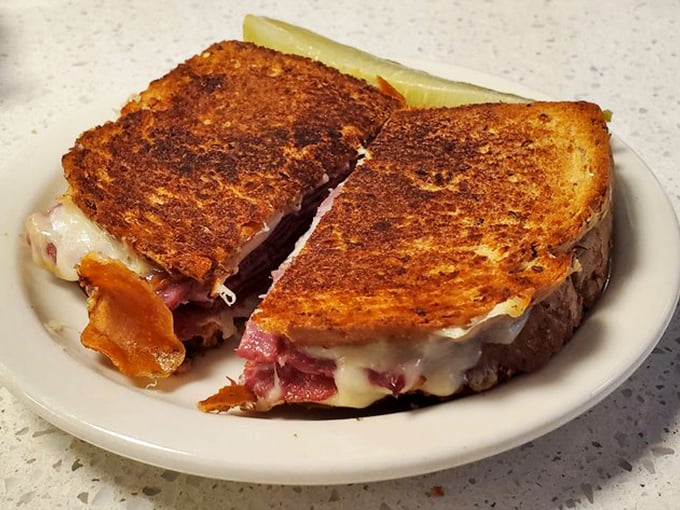 The grilled pastrami sandwich arrives perfectly toasted, cheese melting like an avalanche down the mountainside of meat.