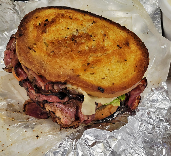 A pastrami Reuben that deserves its own parade. The perfect marriage of smoky meat, tangy kraut, and grilled rye bread.