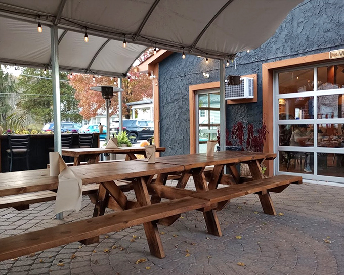 Picnic tables under a canopy create that perfect "I'm outdoors but not at the mercy of the elements" dining experience.