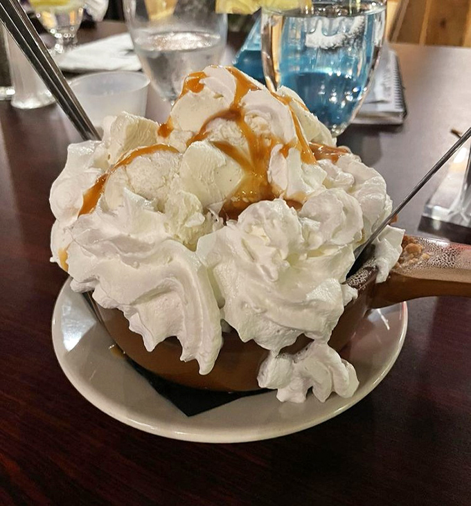 This isn't just dessert&mdash;it's a mountain of whipped cream with caramel drizzle that requires its own zip code. Spoons at the ready!
