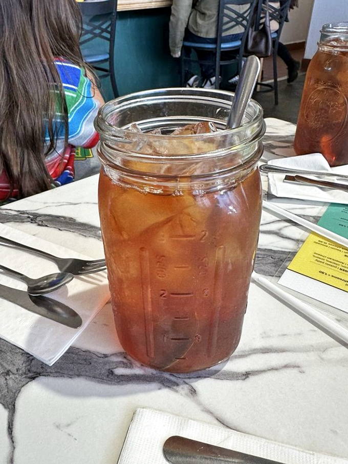 Mason jar iced tea: the unofficial summer beverage of the Sierra foothills, served in glassware that screams "you're in good country now."