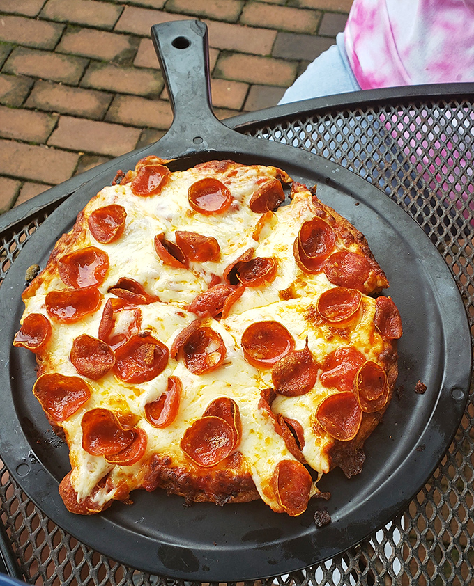 A cast-iron skillet pizza with pepperoni that curls into perfect little flavor cups &ndash; proof that sometimes the simplest dishes deliver the most satisfaction.