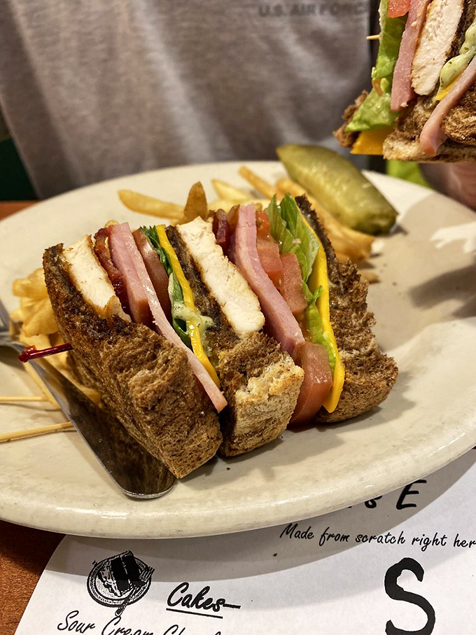 This club sandwich isn't just stacked&mdash;it's strategically engineered for maximum flavor in every bite. The toothpick is holding back greatness.