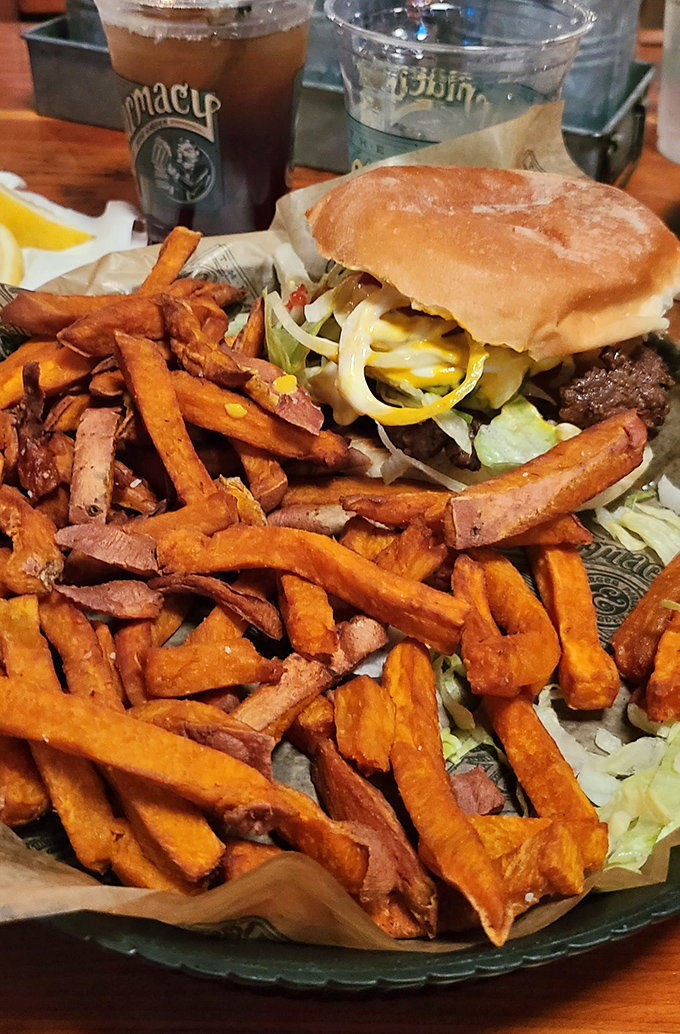 The Pharmacy Burger alongside sweet potato fries creates a color palette so beautiful you almost feel bad eating it. Almost.