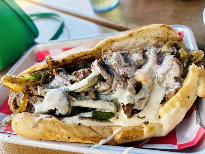 This cheesesteak isn't messing around—it's the kind of sandwich that demands both hands and possibly a nap afterward.