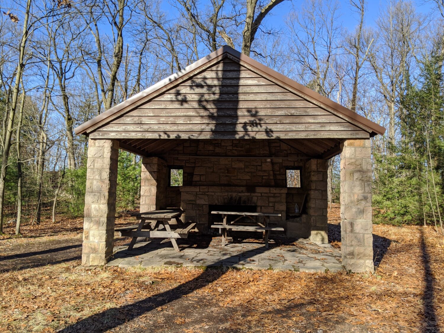 Stone picnic pavilions built by the CCC stand as monuments to craftsmanship, offering shelter and gathering spaces for generations.