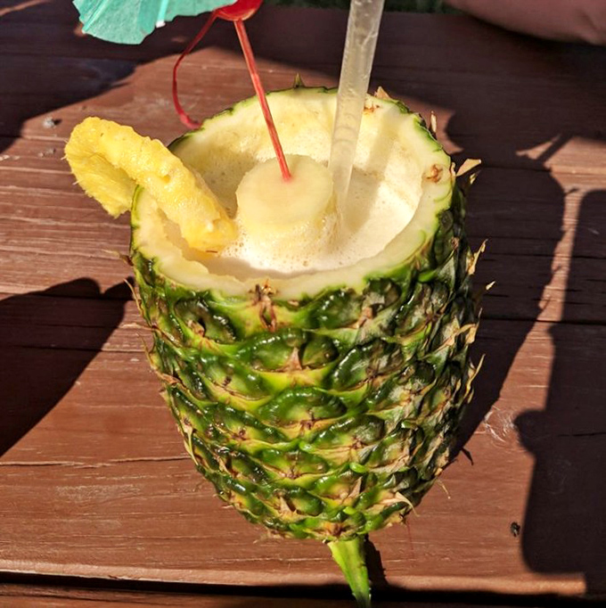Vacation in a pineapple cup! This tropical concoction makes you forget you're in Ohio faster than you can say "Where's my tiny umbrella?"