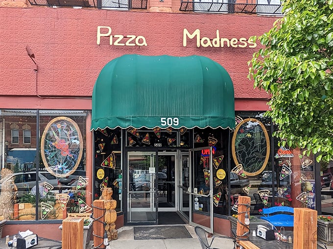 Pizza Madness serves up slices of happiness under that distinctive green awning, where comfort food meets comfortable prices.