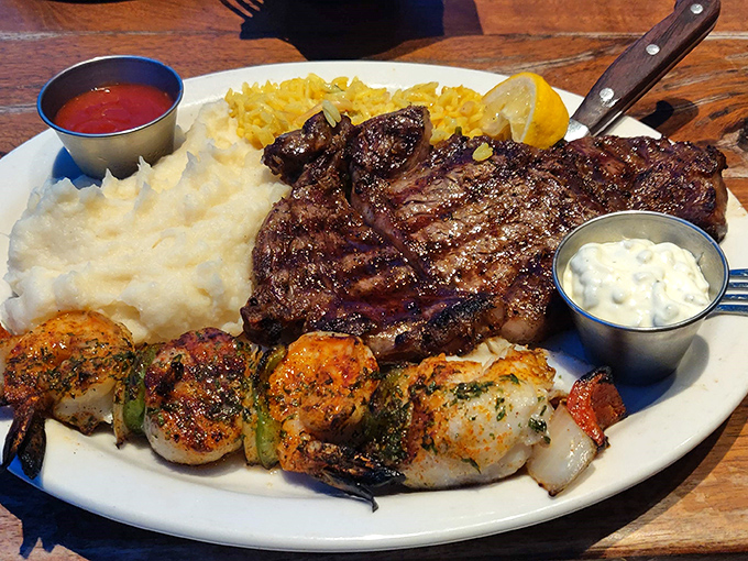 When land meets sea on a single plate: a perfectly grilled steak alongside succulent shrimp skewers proves that surf and turf isn't just a meal&mdash;it's a philosophy.
