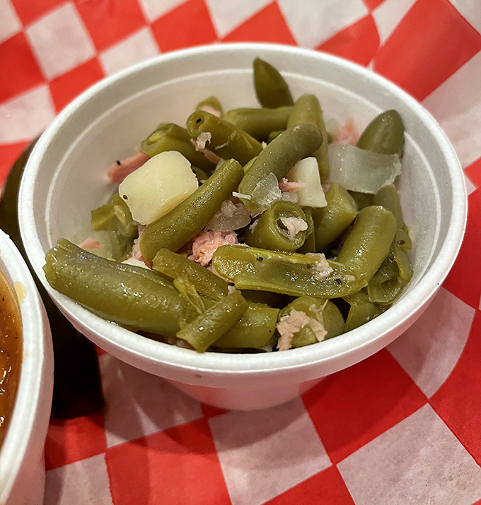Green beans swimming with bits of pork&mdash;because at Fatback's, even the vegetables get a meaty makeover worth writing home about.
