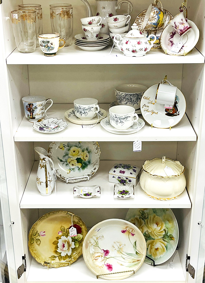 Delicate teacups and saucers that would make your grandmother swoon, displayed with the reverence usually reserved for museum pieces.