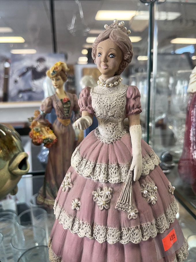 Porcelain faces from another era gaze out with painted expressions. Someone's cherished collectible becomes your conversation piece for less than a fancy dinner.