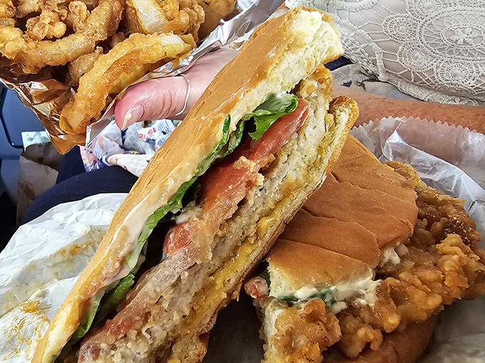 The pork tenderloin sandwich that requires its own zip code. This Midwest classic laughs at your bread-to-meat ratio expectations.