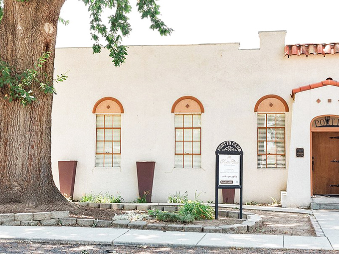 The Portia Club's elegant simplicity speaks of a time when buildings weren't afraid of symmetry. Those arched windows have witnessed decades of community gatherings. 