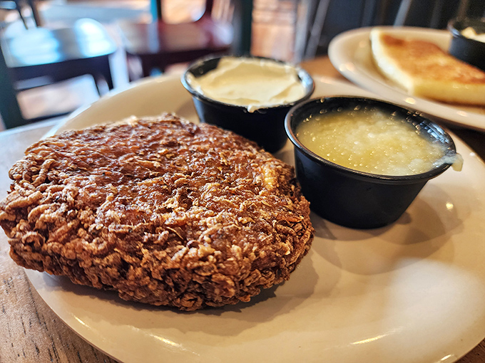 Golden potato latkes with the perfect crunch-to-softness ratio, flanked by applesauce and sour cream—the eternal debate solved by having both.
