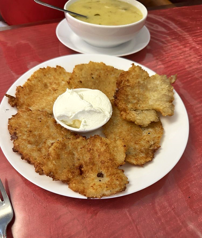Potato pancakes come crispy and enormous, served with sour cream and dreams of Eastern European grandmothers smiling down approvingly.